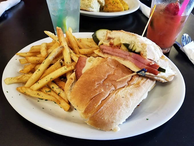 The Cuban sandwich arrives with fries so perfectly seasoned they deserve their own fan club. Lunch nirvana achieved.