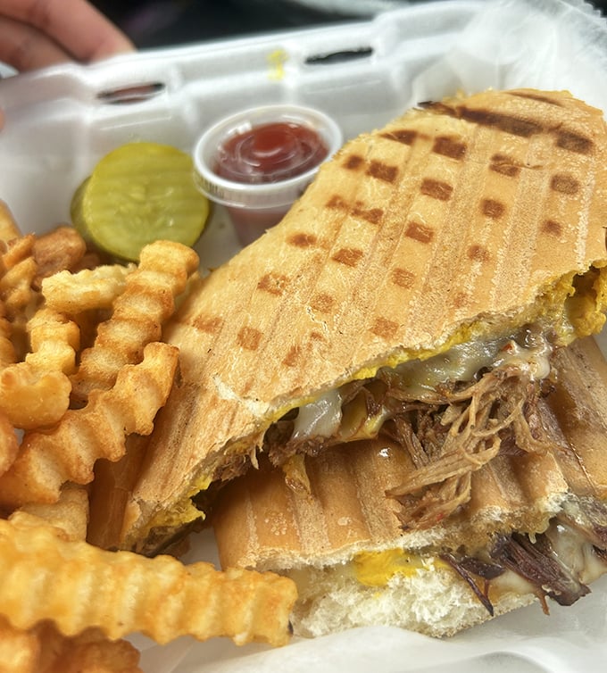 This Cuban sandwich isn't just pressed—it's been persuaded into a state of crispy, meaty, pickle-punctuated perfection. Worth every delicious calorie.