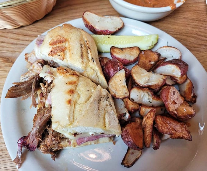 Cuban sandwich perfection with crispy potato companions - lunch never looked so tempting or perfectly constructed.