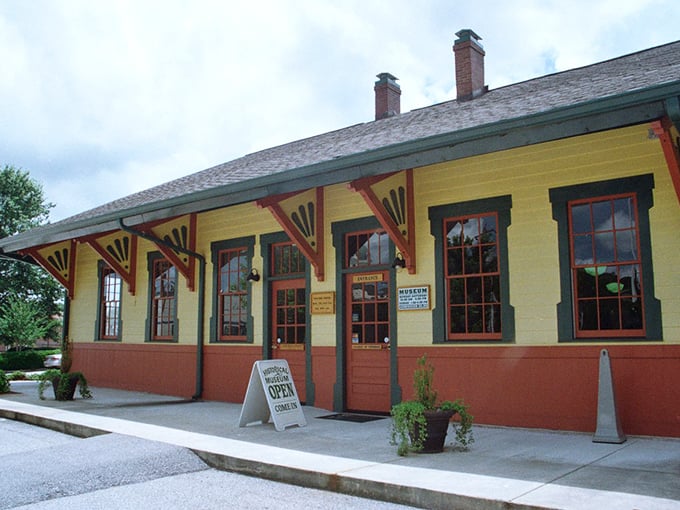 The Currahee Military Museum's vibrant yellow exterior belies the solemn history within—a colorful tribute to the paratroopers who trained on nearby mountains.