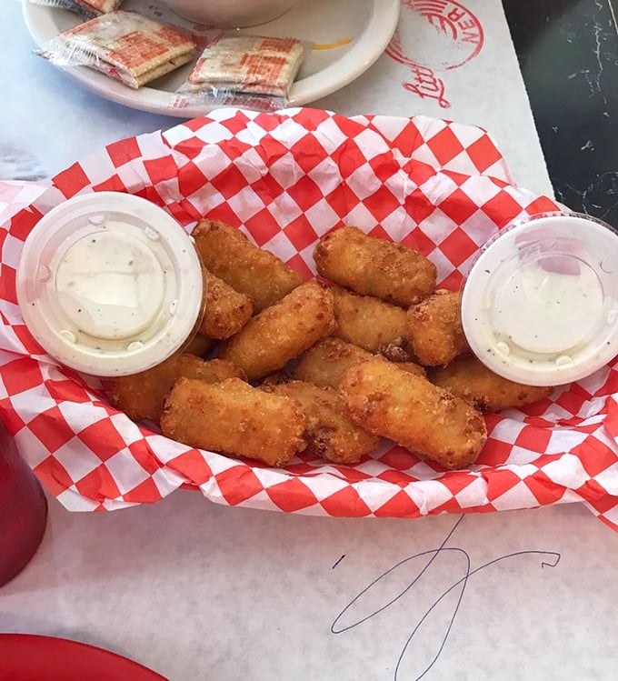 These golden-fried mac and cheese bites aren't just appetizers—they're little time machines that transport you back to childhood, only with better cheese.