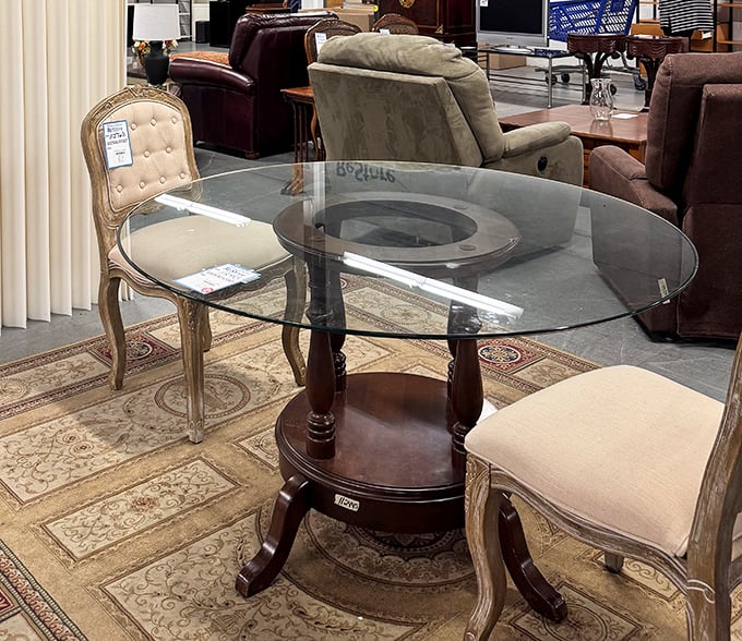 Elegant glass-top dining with vintage-inspired chairs—because eating takeout feels fancier when you're not balancing it on your lap while watching Jeopardy.