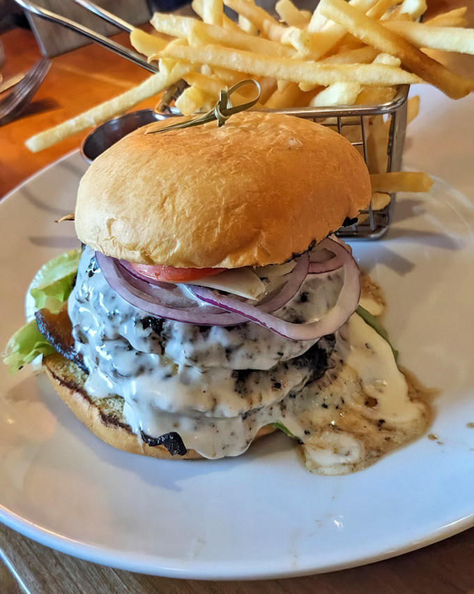 The burger that launched a thousand diet cheat days. Melty cheese cascading down double patties—resistance is both futile and foolish.