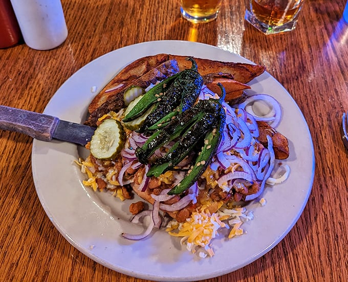 The Eastwood burger arrives with grilled jalapeños standing at attention, ready to make your day with every spicy, cheese-laden bite.