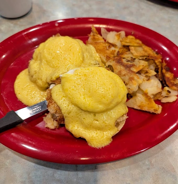 Eggs Benedict done right—golden hollandaise blanketing perfectly poached eggs, the breakfast that turns ordinary mornings into special occasions.