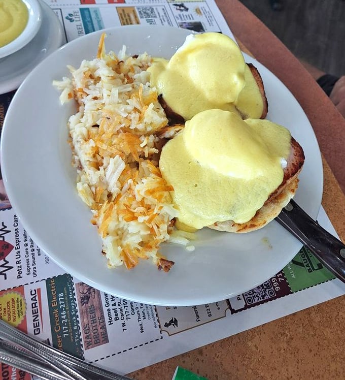 Eggs Benedict done right—a hollandaise so sunny it could brighten even the gloomiest Monday morning. The hash browns provide the perfect supporting role.