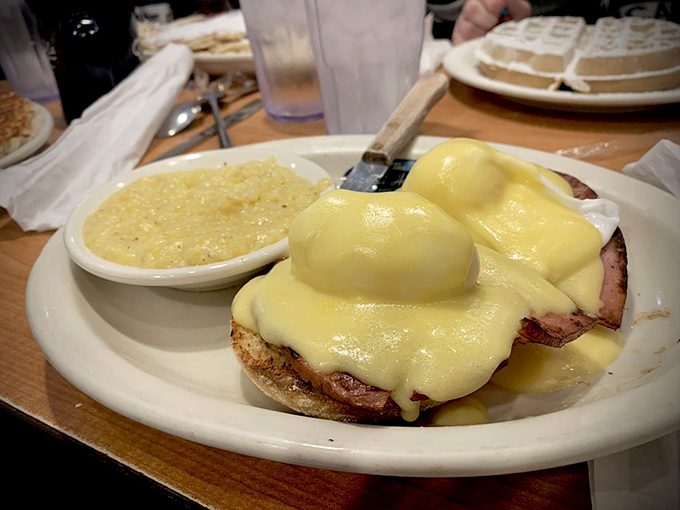 Eggs Benedict done right—a golden waterfall of hollandaise cascading over Canadian bacon. Whoever Benedict was, we owe him a serious debt of gratitude.