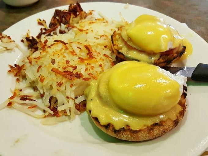 Eggs Benedict with perfectly golden hash browns—the breakfast equivalent of hitting the jackpot before your first cup of coffee.