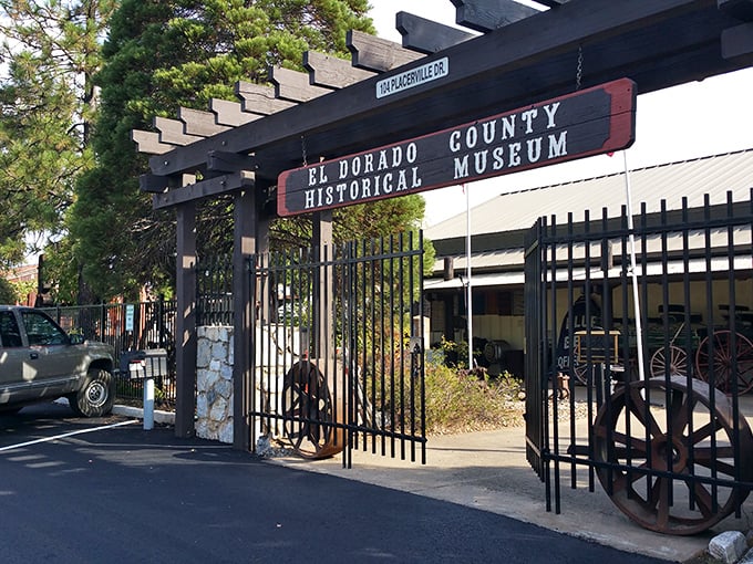 The El Dorado County Historical Museum entrance promises stories more valuable than gold. Those wagon wheels have rolled through centuries of California history.