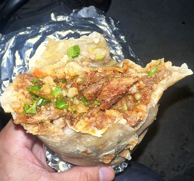 Unwrapped like a present, this burrito reveals its inner glory—a mosaic of flavors wrapped in a tortilla hug.