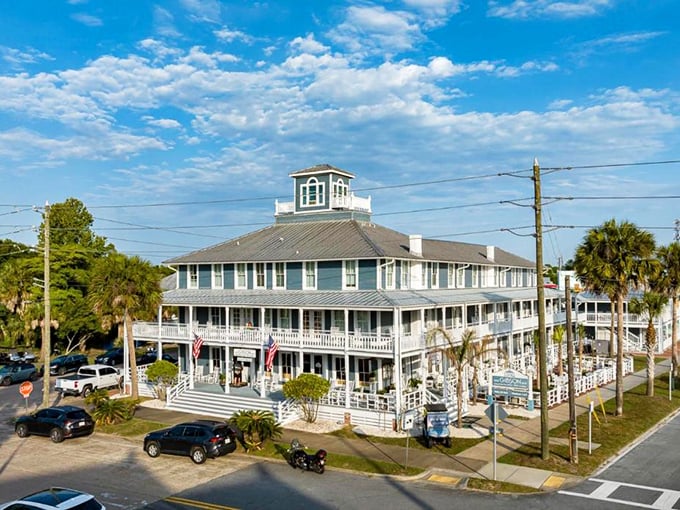 This isn't just a building—it's architectural sweet tea, refreshing the streetscape with its multi-tiered porches and coastal blue charm.