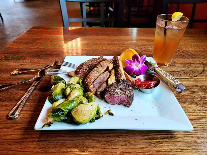 A steak that's dressed for success – the ribeye arrives with Brussels sprouts and a flower garnish that says "fancy, but not pretentious."