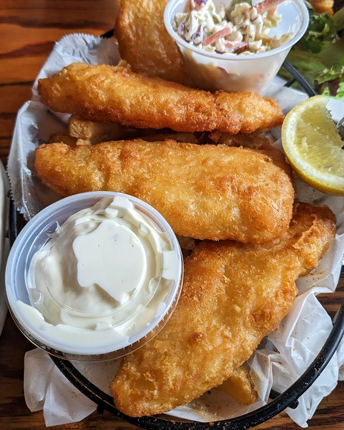 Fish and chips that crackle with each bite—the kind that makes you wonder why you ever settled for drive-thru seafood.