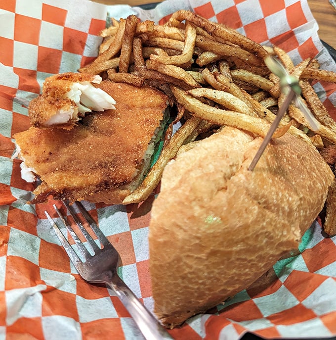 A fish sandwich that proves landlocked doesn't mean flavor-locked – crispy perfection between two buns.