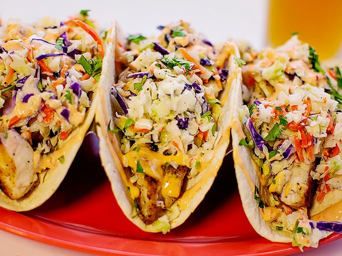 Fish tacos that make you question why you'd ever eat anything else. That slaw isn't just colorful—it's a perfect counterpoint to the fish.