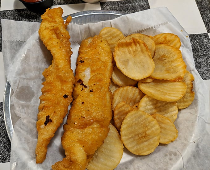 Golden-battered fish and homemade chips that would make any coastal town proud—crispy, light, and begging for a squeeze of lemon.