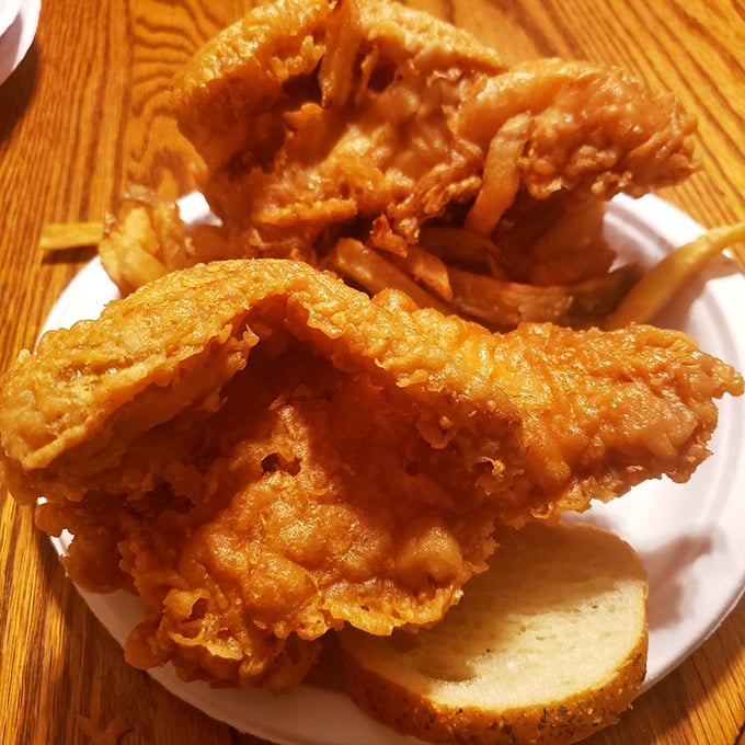 Fried fish that would make coastal snobs reconsider their prejudice against landlocked seafood. The crunch-to-flake ratio is mathematical perfection.