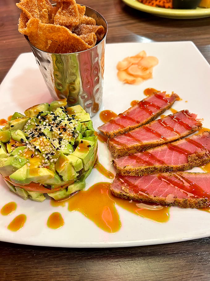 Seared tuna with avocado stack—proof that diners have evolved beyond meatloaf, though honestly, I'd happily eat their meatloaf too.