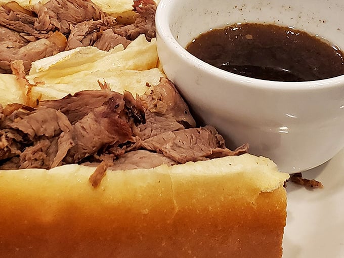 The French Dip: where thinly sliced roast beef meets its soulmate—a warm bath of savory au jus.