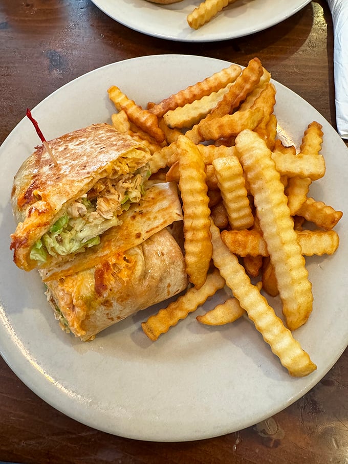This chicken wrap with crinkle-cut fries isn't just lunch—it's therapy on a plate. Notice how they're perfectly arranged for maximum dipping potential.