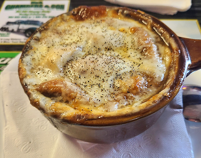 French onion soup with that perfect cheese cap – stretchy, browned, and ready to be broken into like a delicious savory crème brûlée.