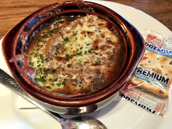 French onion soup that doesn't mess around: a bubbling cauldron of sweet onions and savory broth under a blanket of melted cheese that stretches for days.