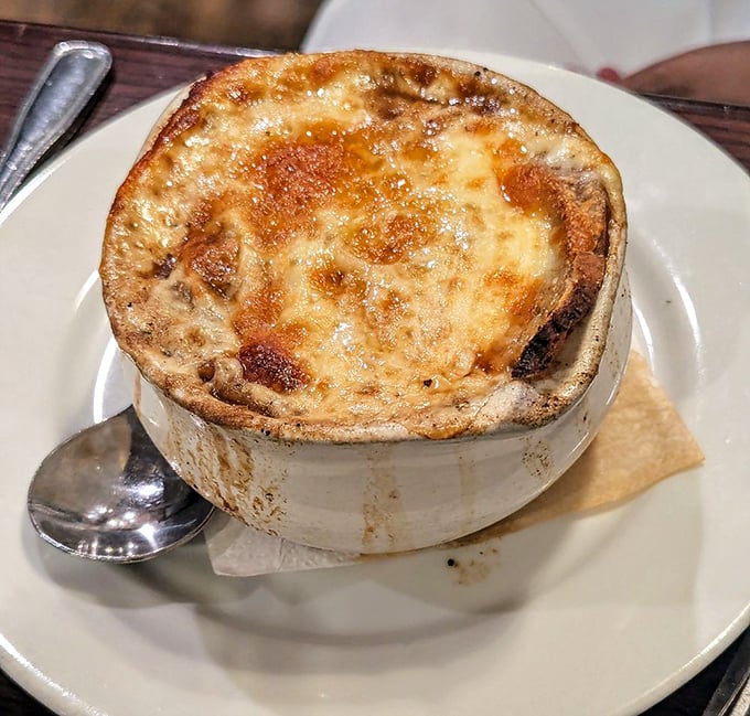 The star of the show—French onion soup with that glorious crown of golden, bubbling cheese. Worth the inevitable chin dribble and momentary loss of dignity.