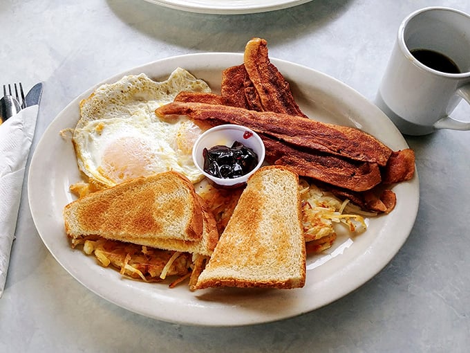 The breakfast trinity—eggs, bacon, and toast—elevated to art form. Simple perfection that makes you wonder why you'd ever eat anything else.