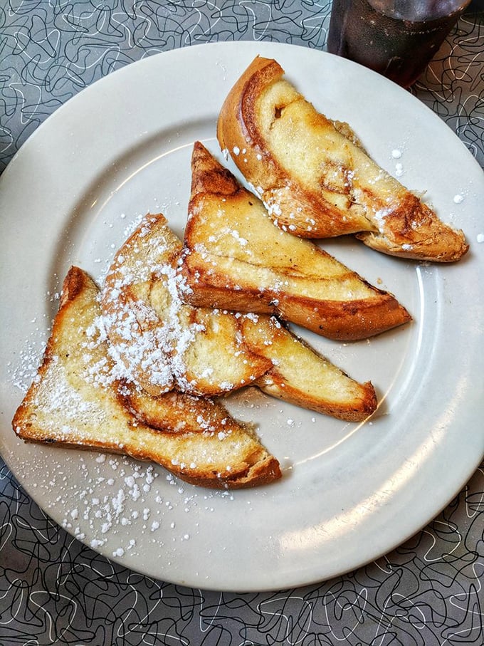 Cinnamon French toast dusted with powdered sugar—the breakfast that thinks it's dessert, and nobody's complaining about it.