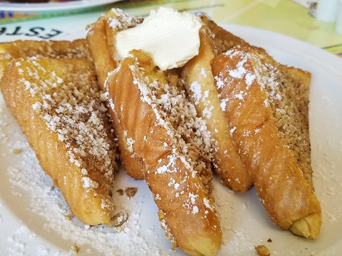 French toast that's achieved the impossible balance of crispy exterior and custardy interior – the breakfast equivalent of hitting the lottery.