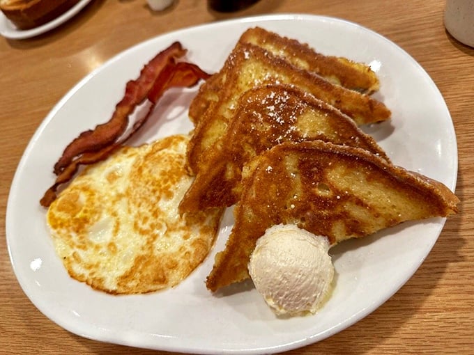 French toast that arrived dressed for Sunday brunch, with bacon standing at attention like crispy soldiers.