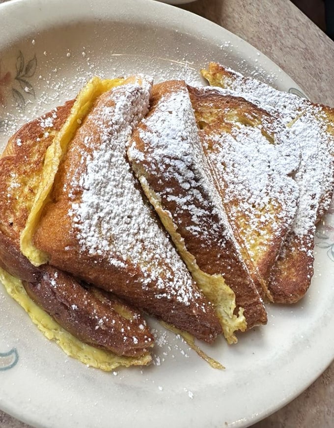 French toast dusted with powdered sugar—the breakfast equivalent of wearing a tuxedo to a backyard barbecue. Fancy, yet comfortable.