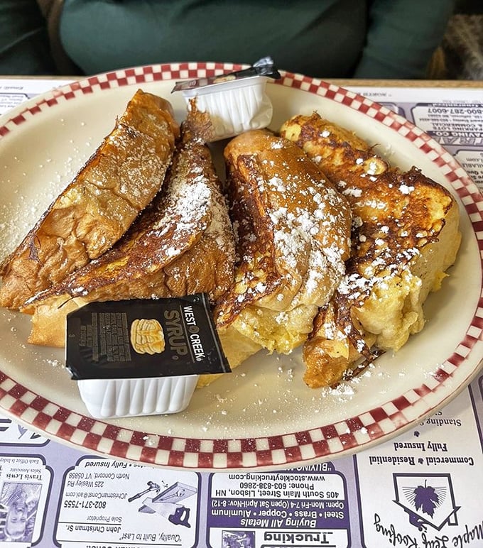 French toast that makes you wonder if bread has been holding out on you all these years. That maple syrup puddle isn't an accident—it's destiny.