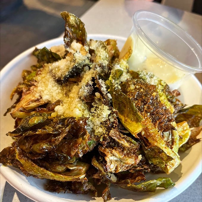 Brussels sprouts that could convert even the most dedicated vegetable skeptics—crispy, caramelized, and dusted with parmesan like snowfall on flavor mountains.