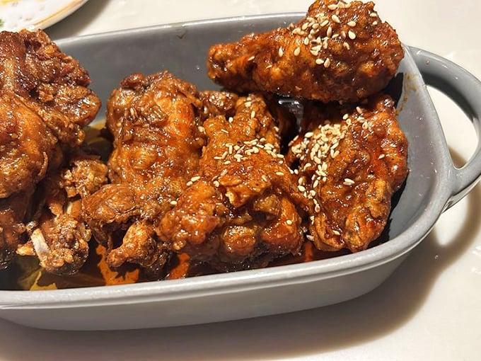 These Korean fried chicken wings aren't just crispy – they've achieved that mythical texture that makes you wonder if they attended a special chicken finishing school.