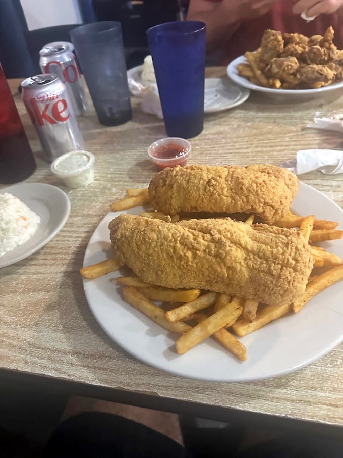 Forget fancy plating—this fried grouper and fries combo is the honest-to-goodness seafood experience Florida locals guard like a secret fishing spot.