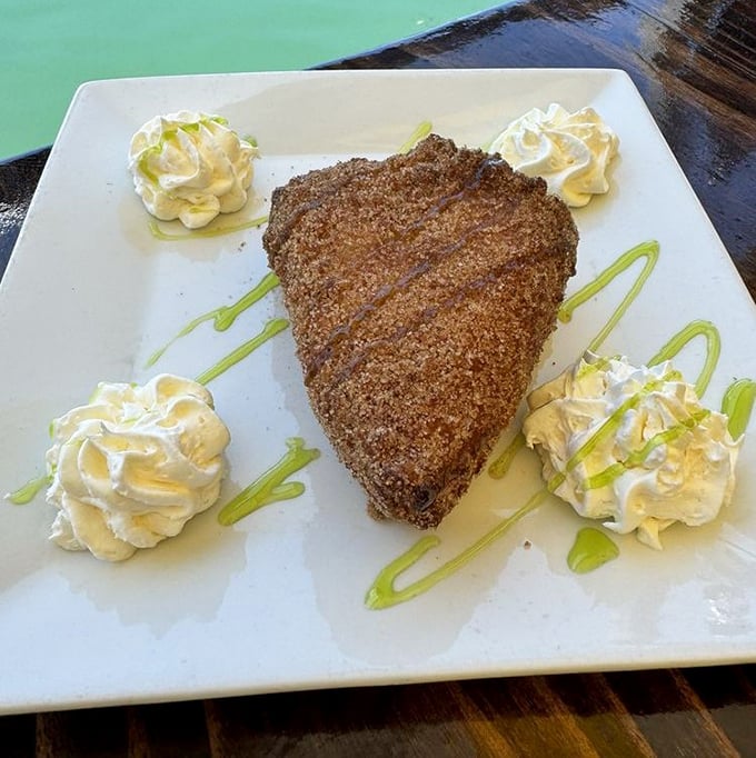 Key lime pie reimagined as a triangle of joy. Those dollops of whipped cream aren't just garnish—they're essential supporting characters.