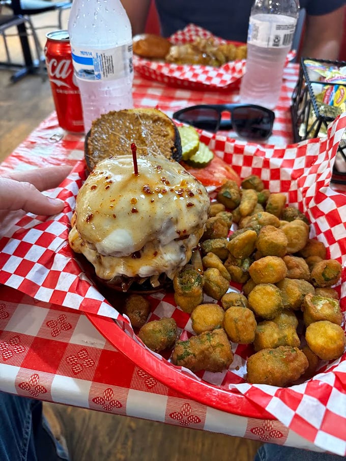 A burger with serious cheese appeal, served alongside golden-fried okra nuggets. Southern comfort that speaks directly to your soul's deepest cravings.