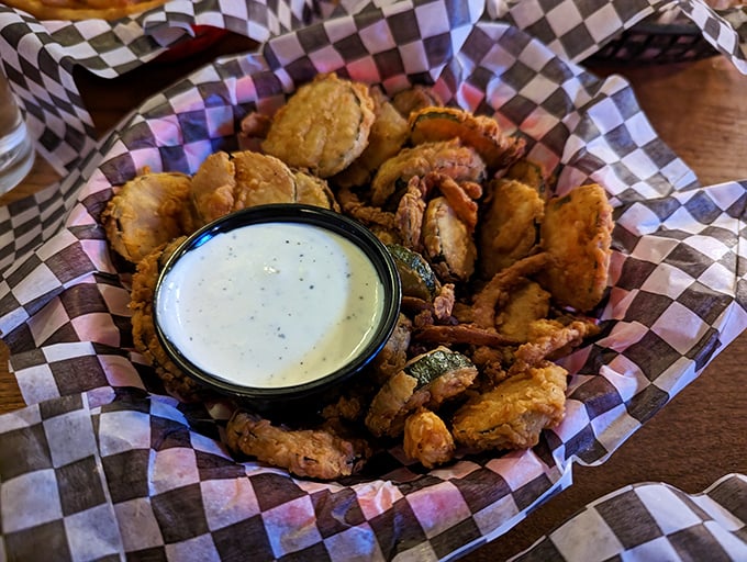 Fried pickles that achieve the impossible: maintaining their crunch while delivering that perfect vinegary zing. The ranch dipping sauce is non-negotiable.