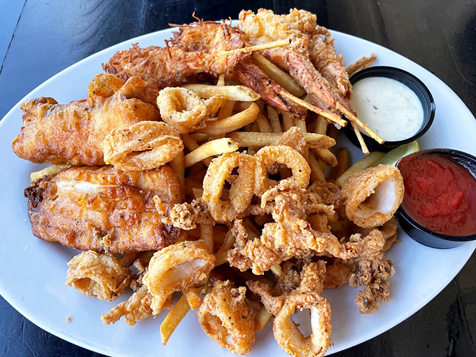 This fried seafood platter isn't just dinner—it's an underwater reunion where fish, shrimp, and calamari gather for one last crispy hurrah.