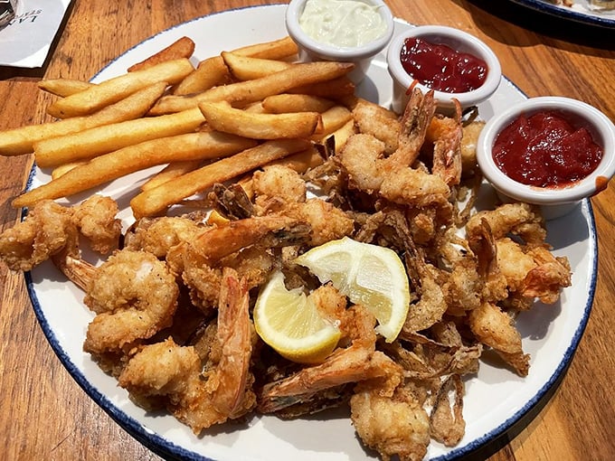 These golden-battered shrimp are the jewelry of the sea—precious morsels that crunch then melt, leaving you reaching for "just one more."