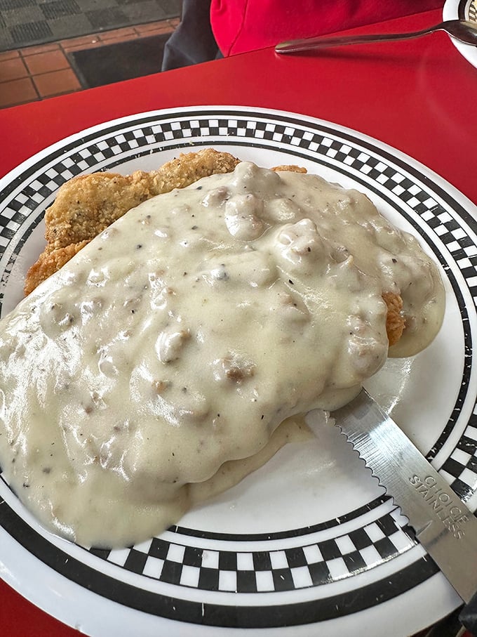 Country fried steak swimming in gravy that could settle family feuds. One bite and you'll understand why regulars set their alarms for breakfast here. 