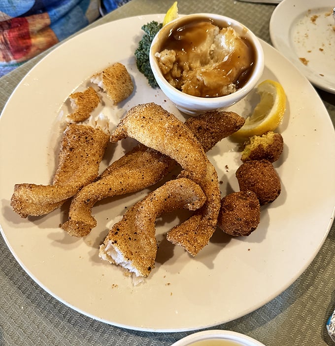 Cornmeal-crusted catfish with a side of mashed potatoes and gravy—Southern comfort that hugs your taste buds like an old friend.