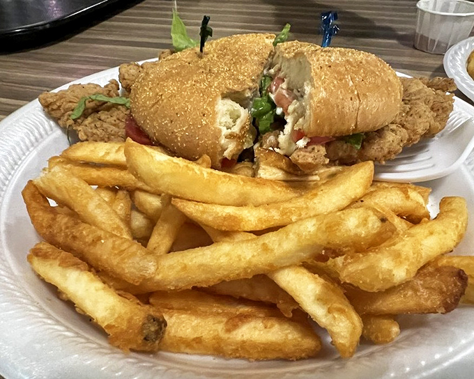 Sandwich architecture at its finest. This isn't just lunch—it's structural engineering with crispy edges and a soft bun that deserves an award.