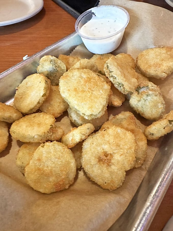 Golden-fried pickle chips with ranch dressing – the perfect tangy counterpoint to rich barbecue. Resistance is futile.