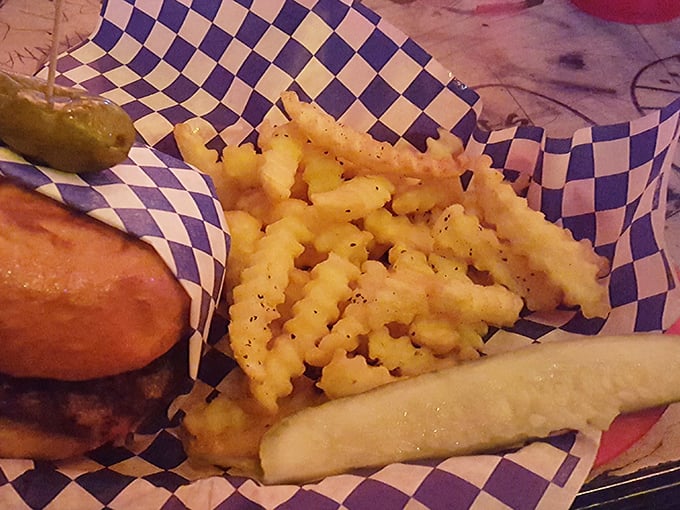 The crinkle-cut fries at Adair's don't need truffle oil or fancy aioli—they're the supporting actors that know exactly how to complement the star.