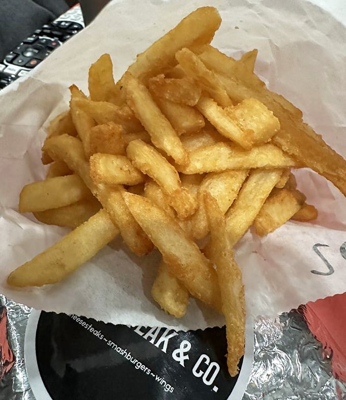 Golden, crispy fries that achieve that perfect balance – substantial enough to dip but not so thick they become potato wedges in disguise.