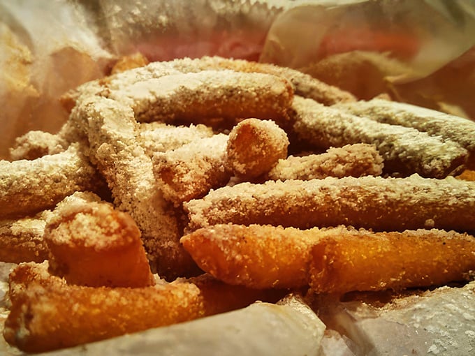 Funnel cake fries dusted with powdered sugar: where state fair nostalgia meets everyday indulgence in downtown Columbus. 