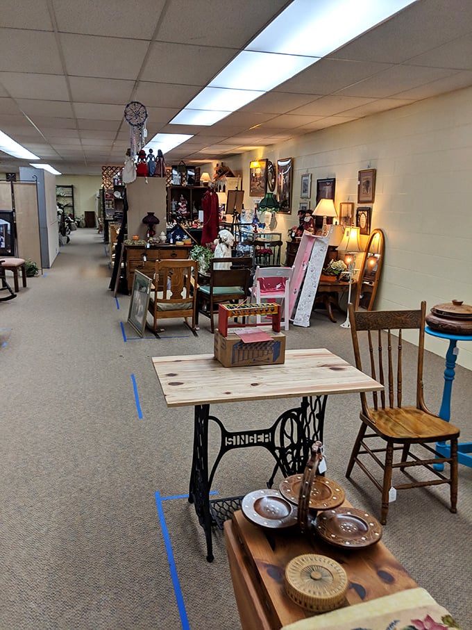 A repurposed Singer sewing machine base supports a handcrafted table, surrounded by chairs that have witnessed decades of family dinners and conversations.
