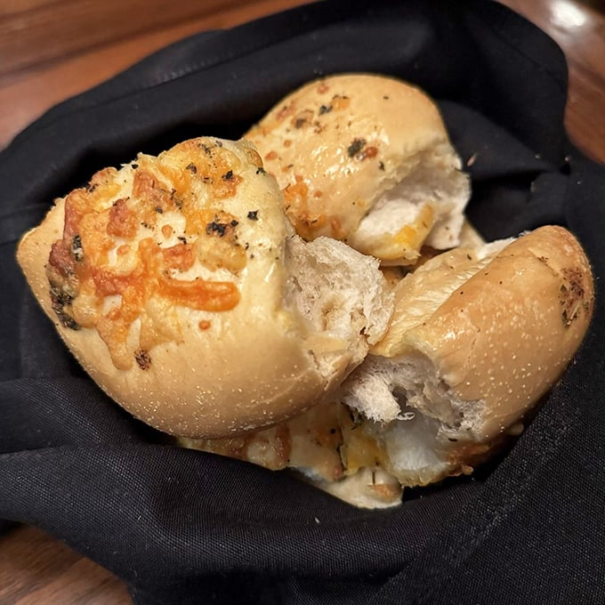 Garlic cheese butter bread that's worth every carb. These golden pillows of flavor might upstage your steak if you're not careful.